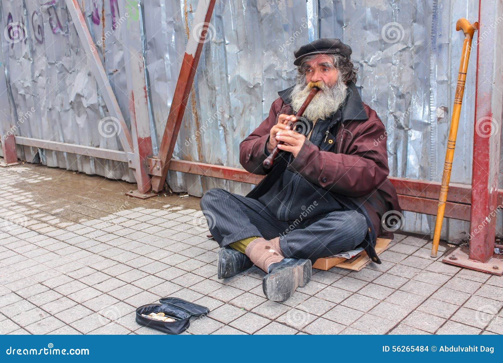 Busker playing flute editorial stock image. Image of mendicant - 56265484