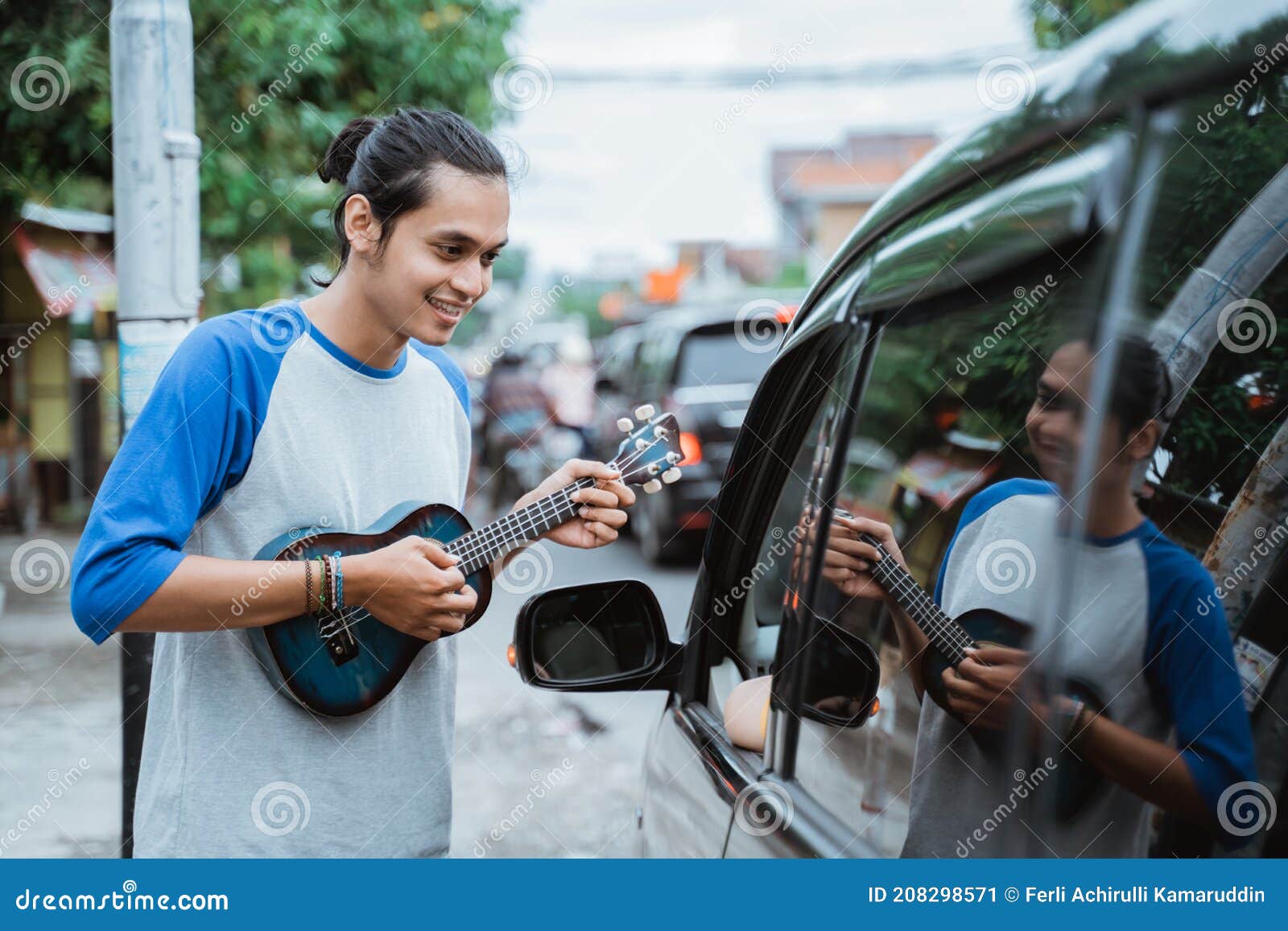 Busker Use Musical Instruments and Sing beside a Car Stock Image ...