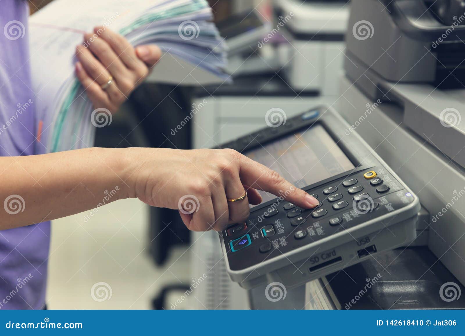 Bussinesswoman Using Copier Machine To Copy Heap of Paperwork in Office ...