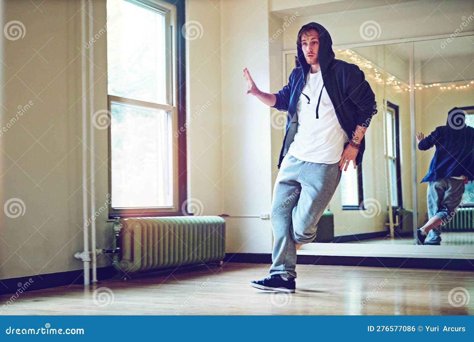 Busting Out those Breakdance Moves. a Young Man Breakdancing in a ...