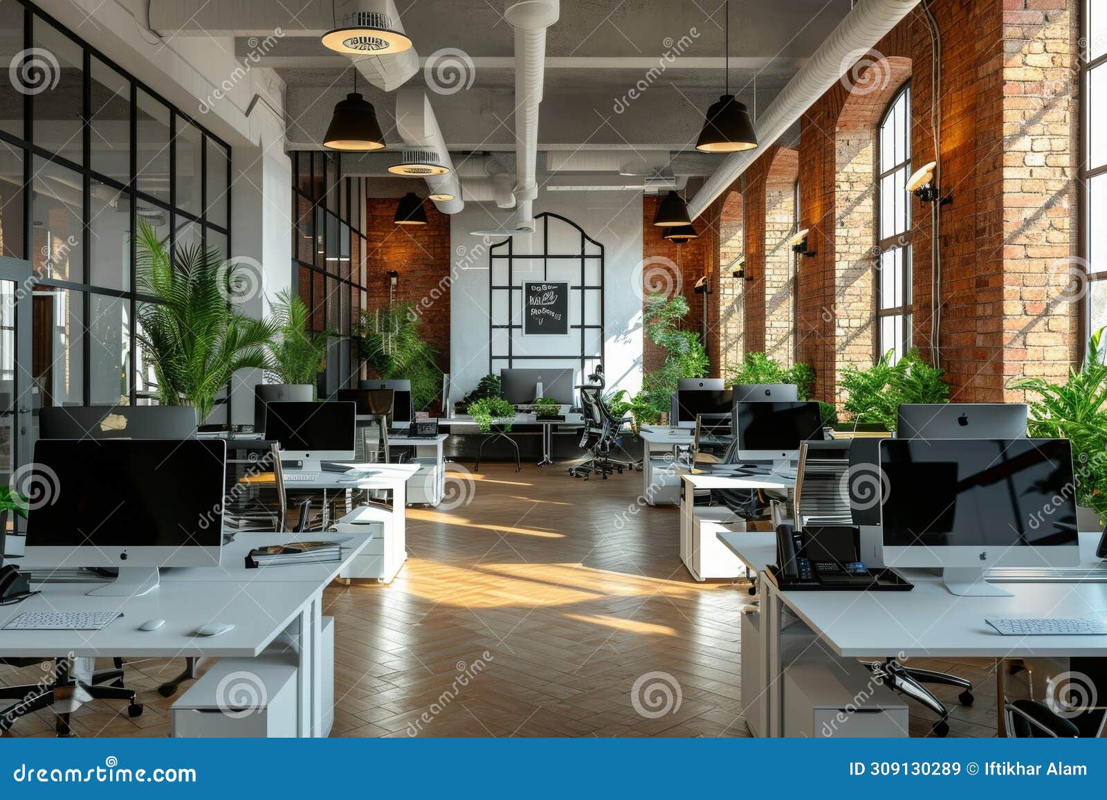 A Bustling Office Filled with Numerous Desks and Computers Where ...