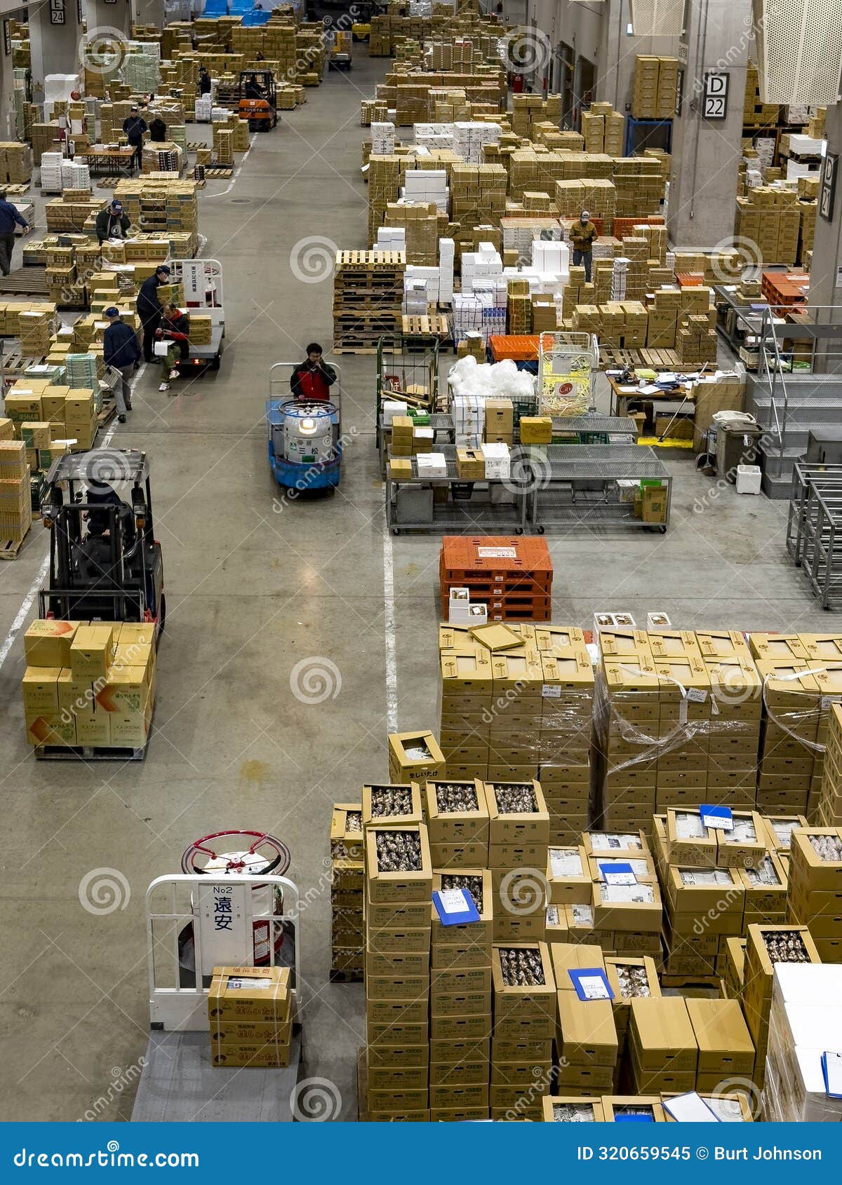 Bustling Warehouse Activity with Workers and Forklifts Editorial Image ...