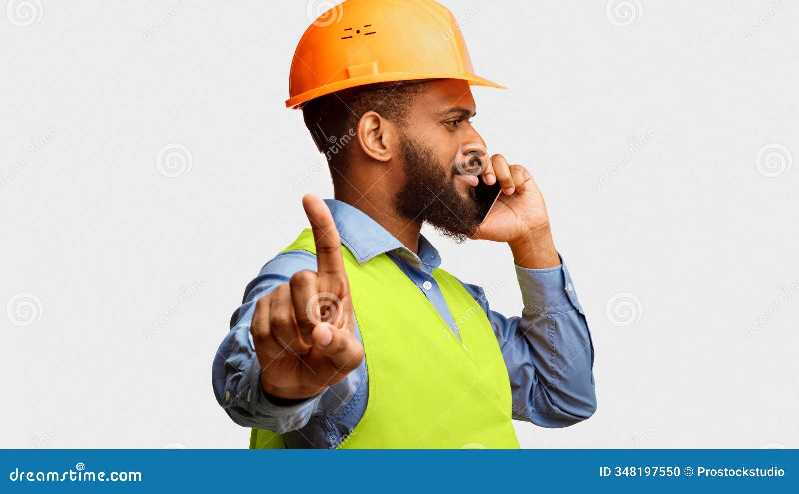 Construction Worker Talking on Cellphone Gesturing To Wait, White ...