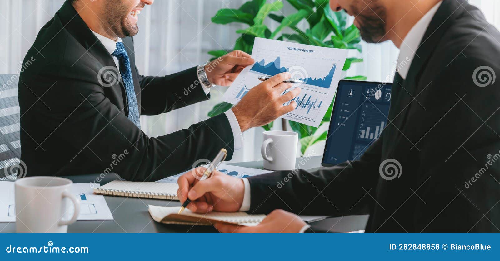 Busy Analyst Team Discussing Financial Data on Laptop. Fervent Stock ...