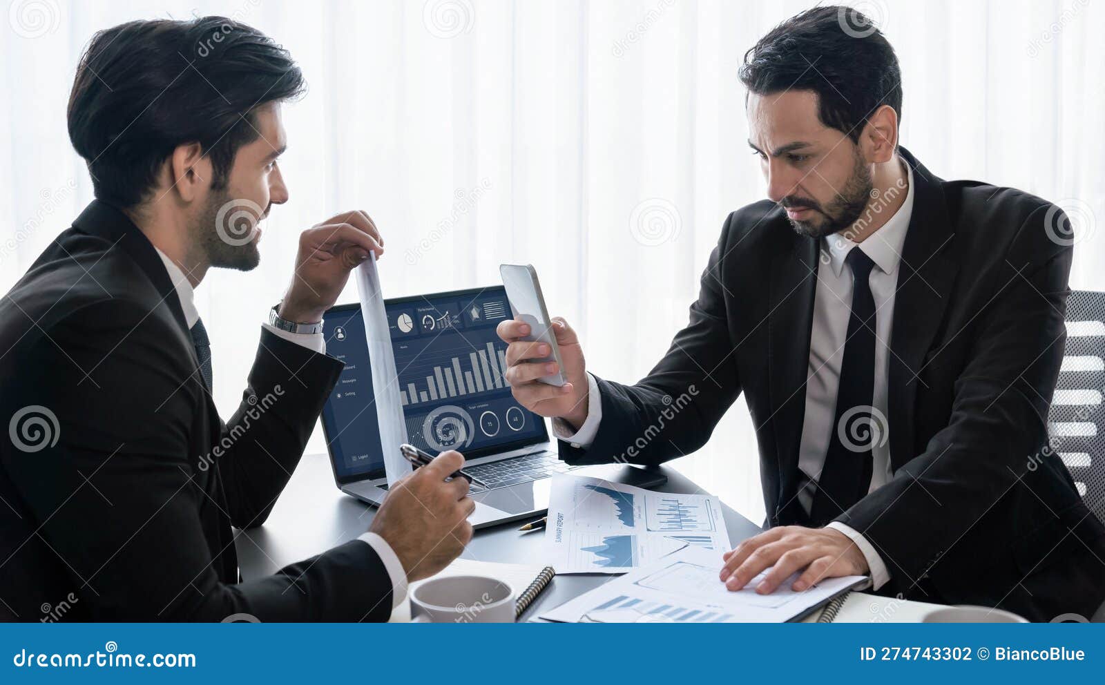 Busy Analyst Team Discussing Financial Data on Laptop. Fervent Stock ...