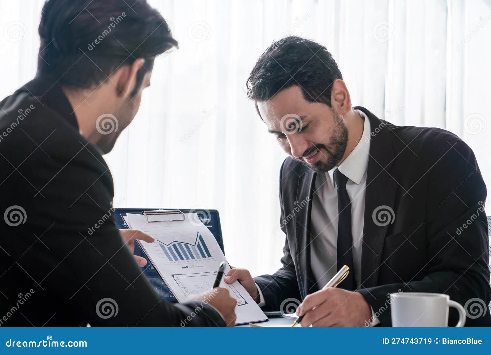 Busy Analyst Team Discussing Financial Data on Laptop. Fervent Stock ...
