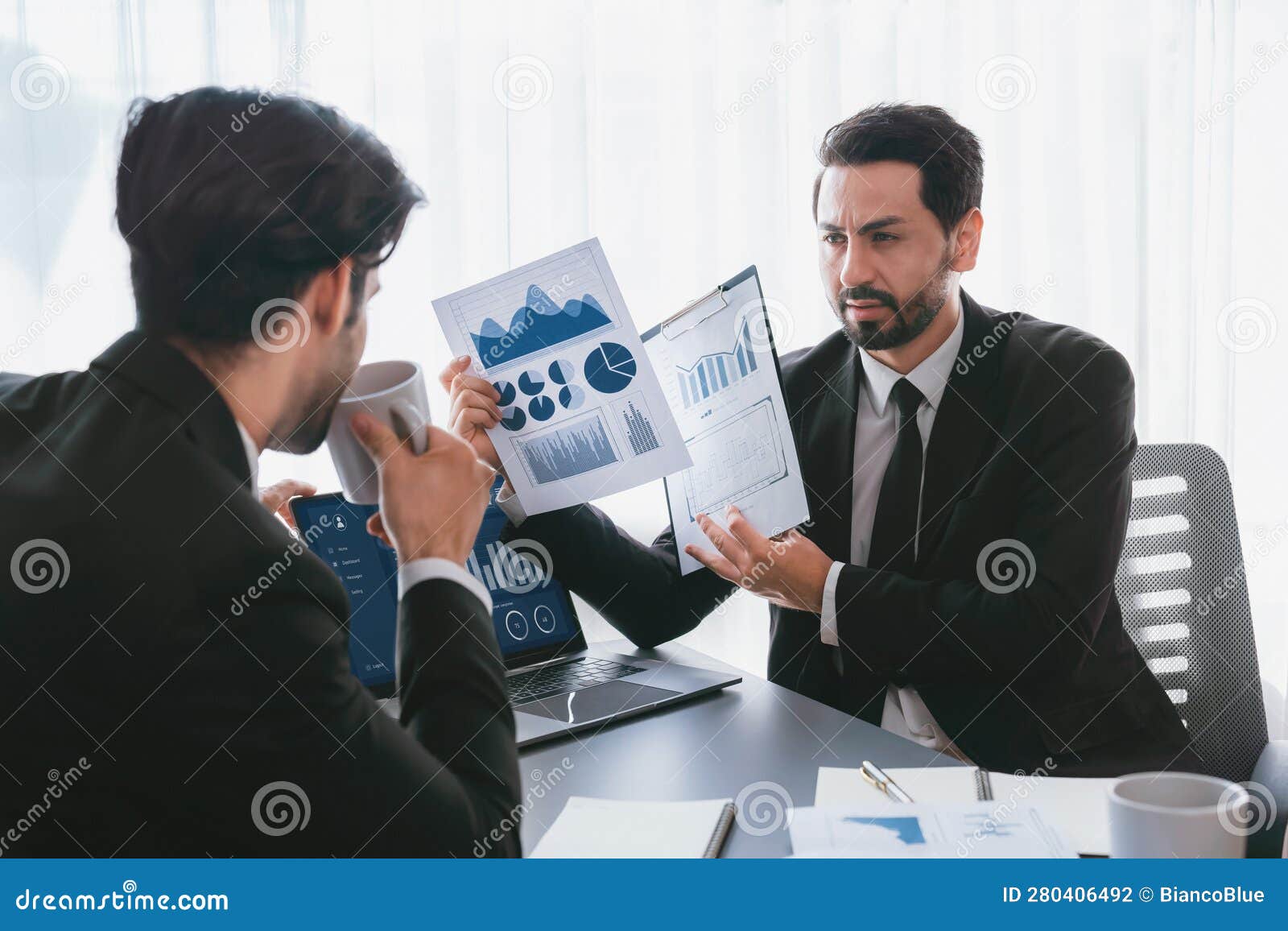 Busy Analyst Team Discussing Financial Data on Laptop. Fervent Stock ...