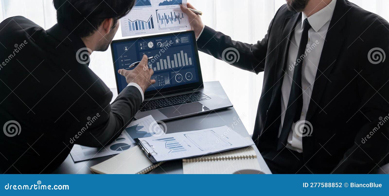 Busy Analyst Team Discussing Financial Data on Laptop. Fervent Stock ...