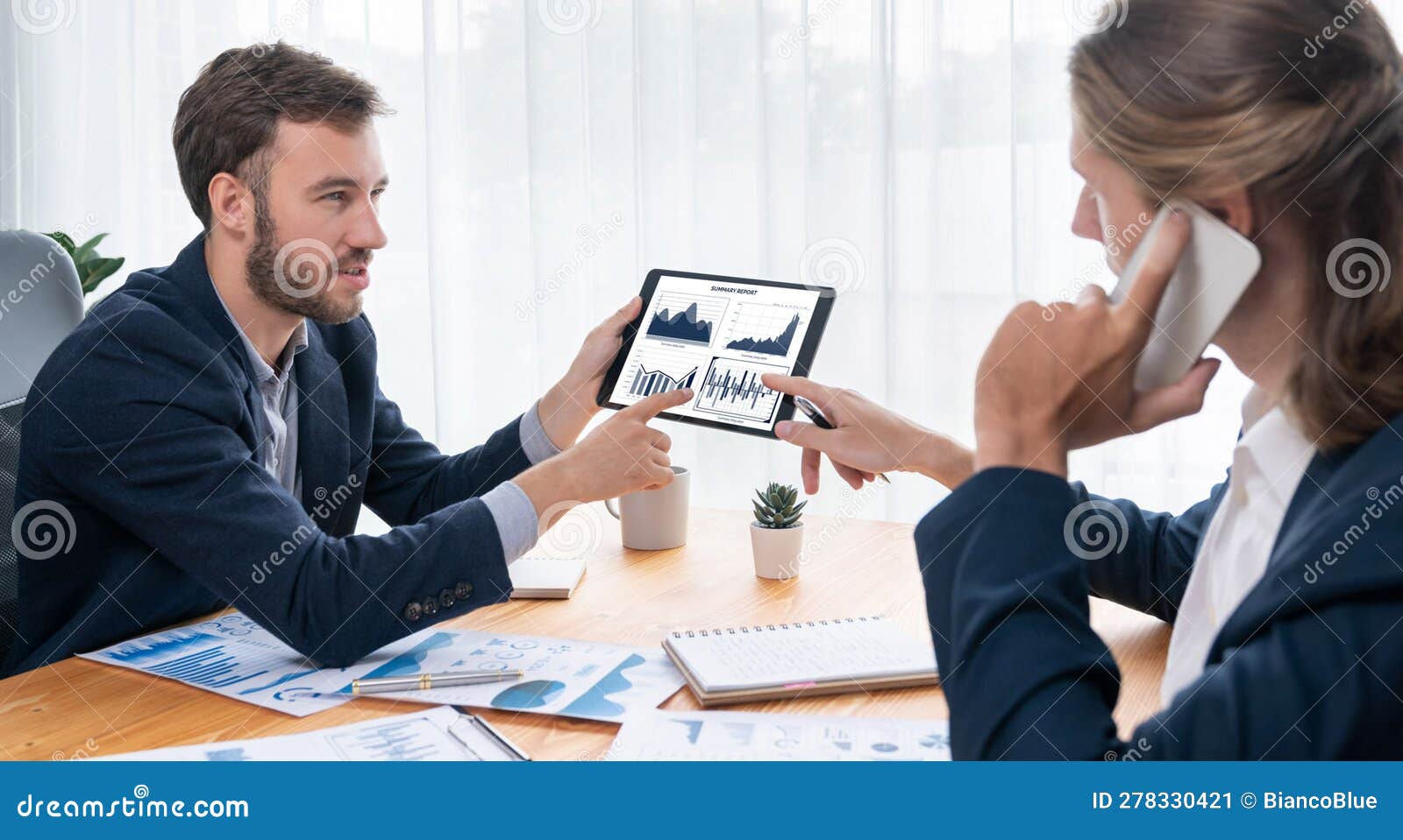 Busy Analyst Team in Office Analyzing Financial Data Analysis by Tablet ...