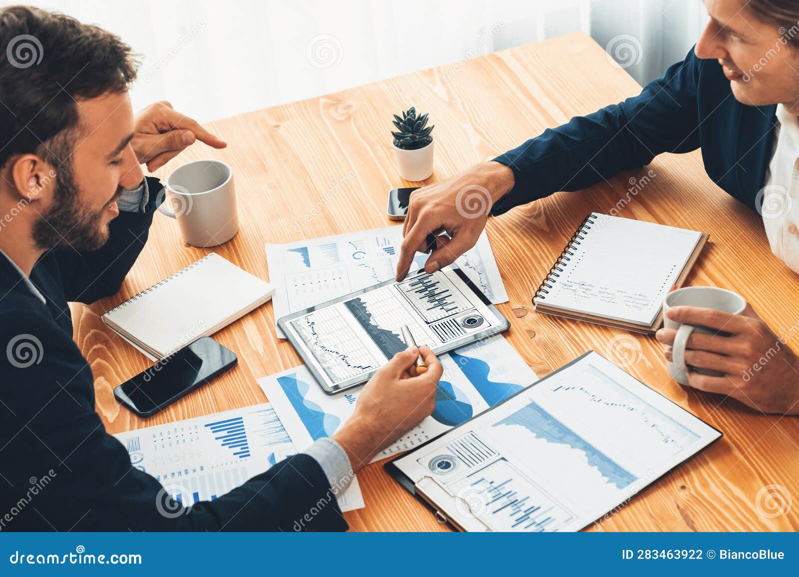 Busy Analyst Team in Office Analyzing Financial Data Analysis by Tablet ...