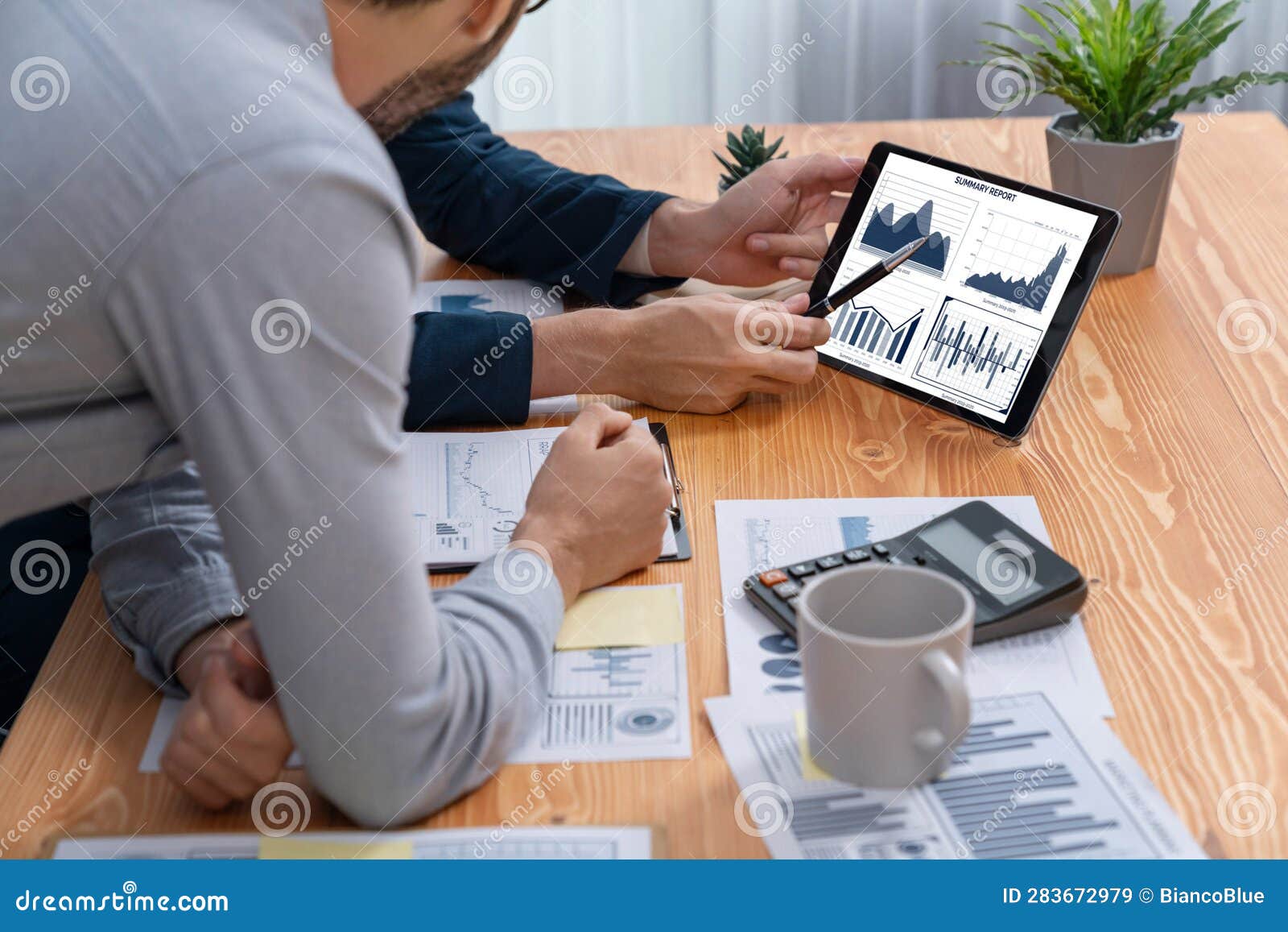 Busy Analyst Team in Office Analyzing Financial Data Analysis by Tablet ...