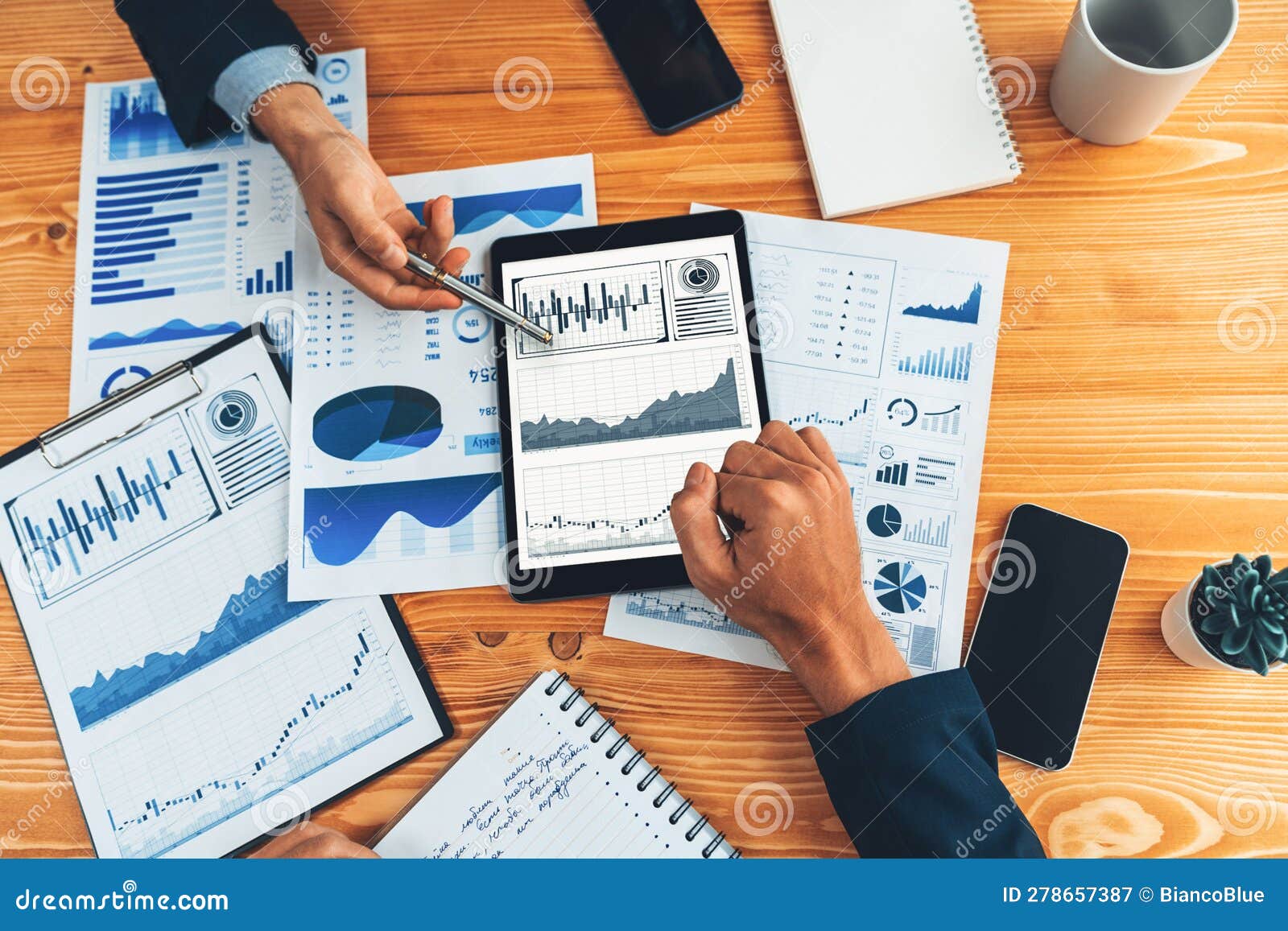 Busy Analyst Team in Office Analyzing Financial Data Analysis by Tablet ...