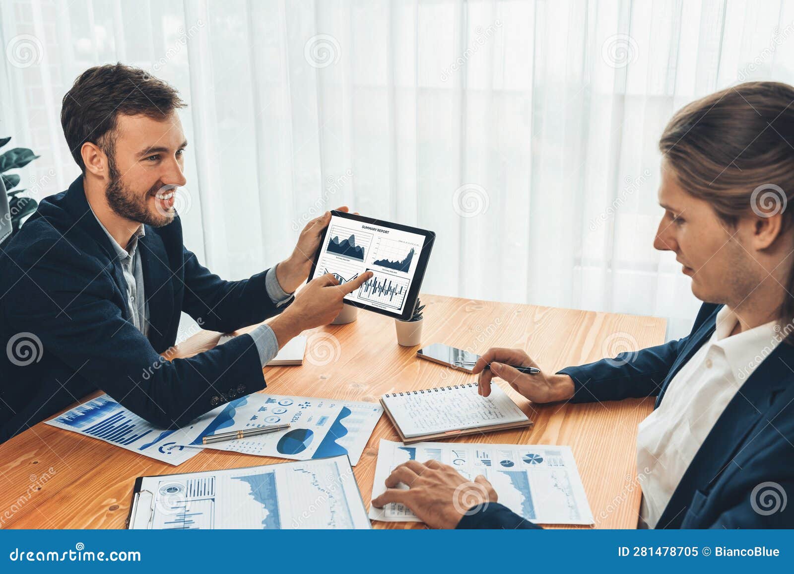 Busy Analyst Team in Office Analyzing Financial Data Analysis by Tablet ...