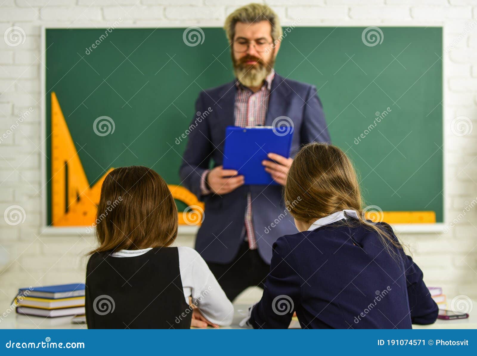 Really Busy. Back To School. Teacher and Pupils Working at Desk ...