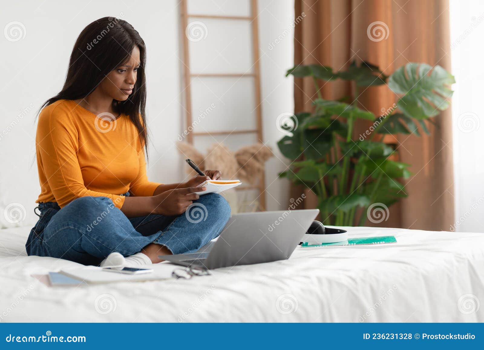 Busy Black Female Taking Notes Learning Using Laptop in Bedroom Stock ...