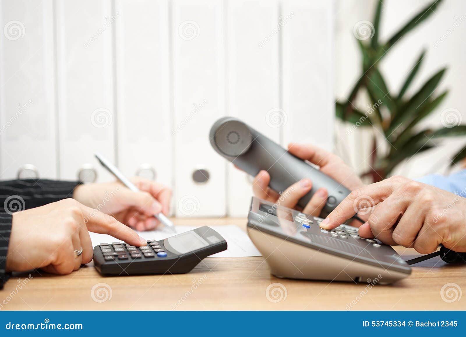 Busy Business People Analyzing Business Data and Calling Customers ...