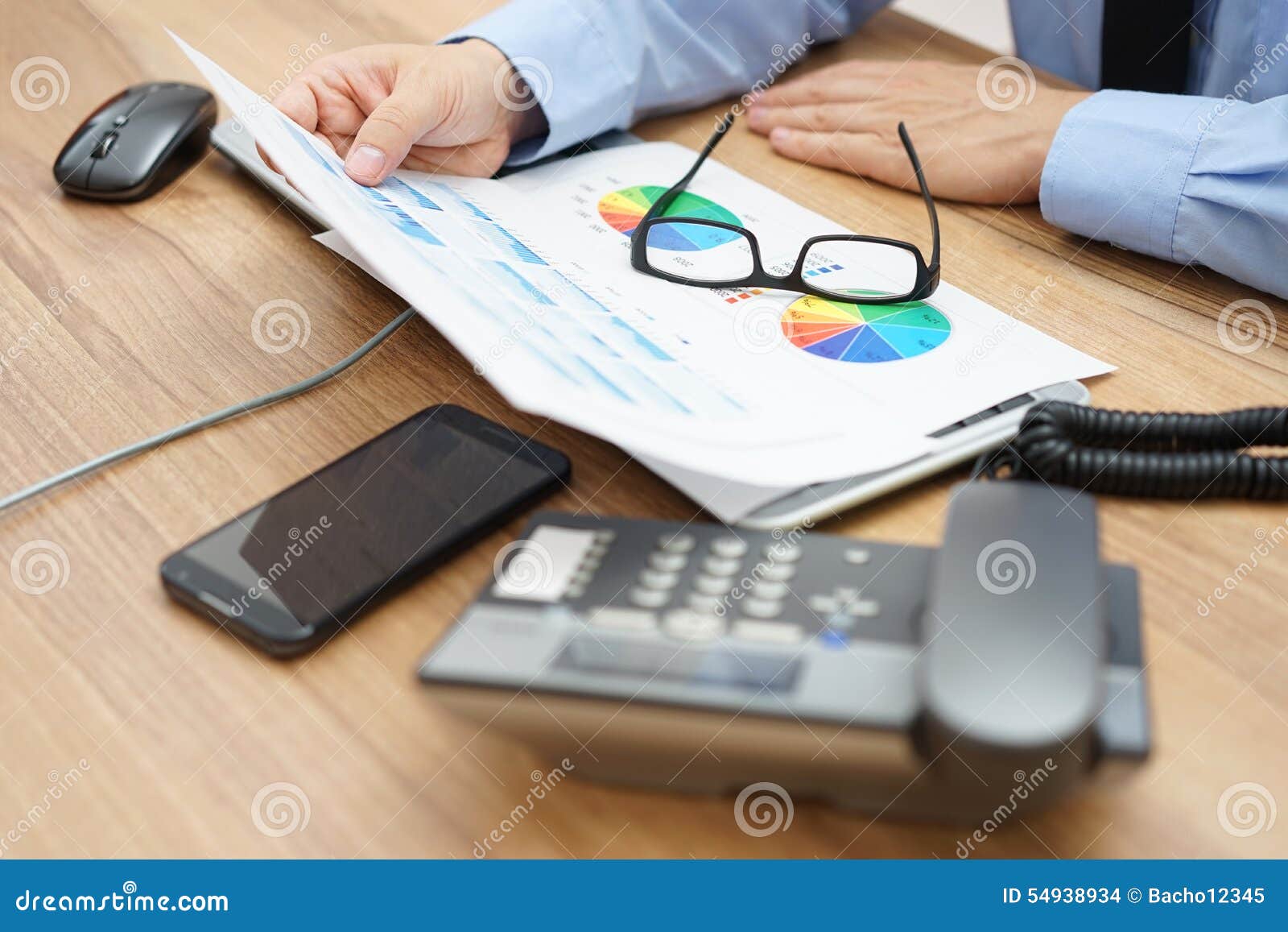 Busy Businessman Analyzing a Lot of Graphs and Business Data at Stock ...