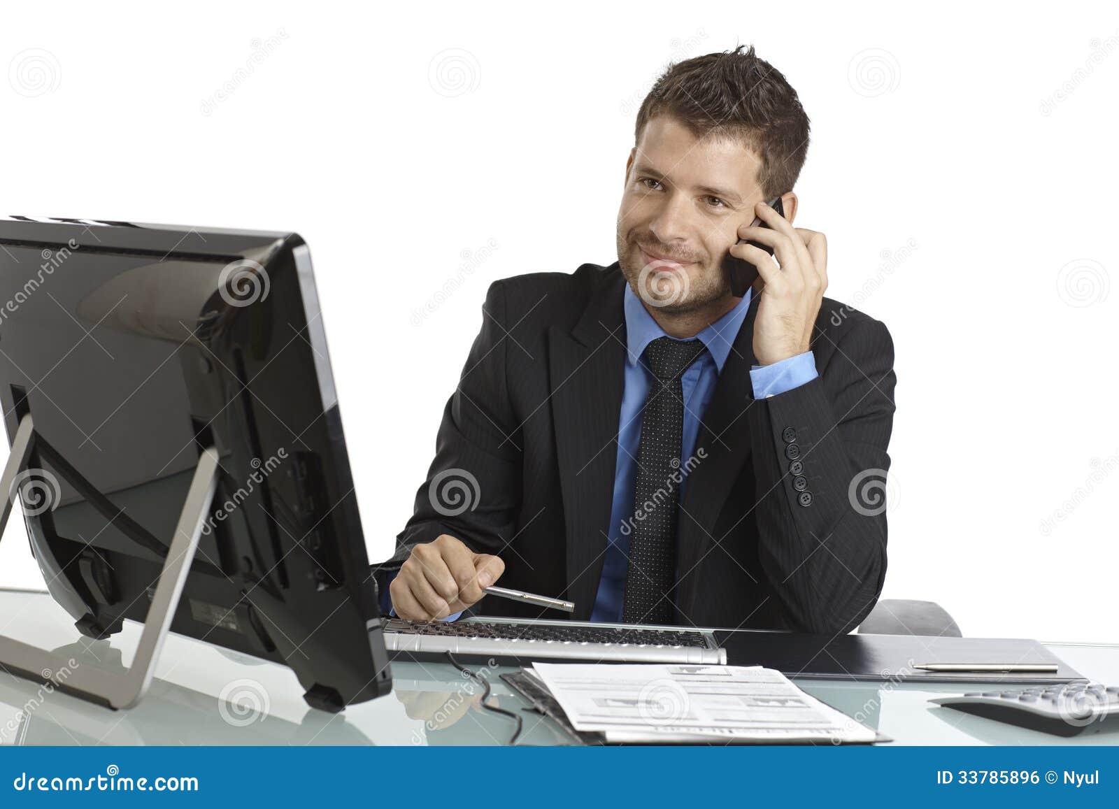 Busy Businessman at Desk Using Mobile Phone Stock Photo - Image of ...