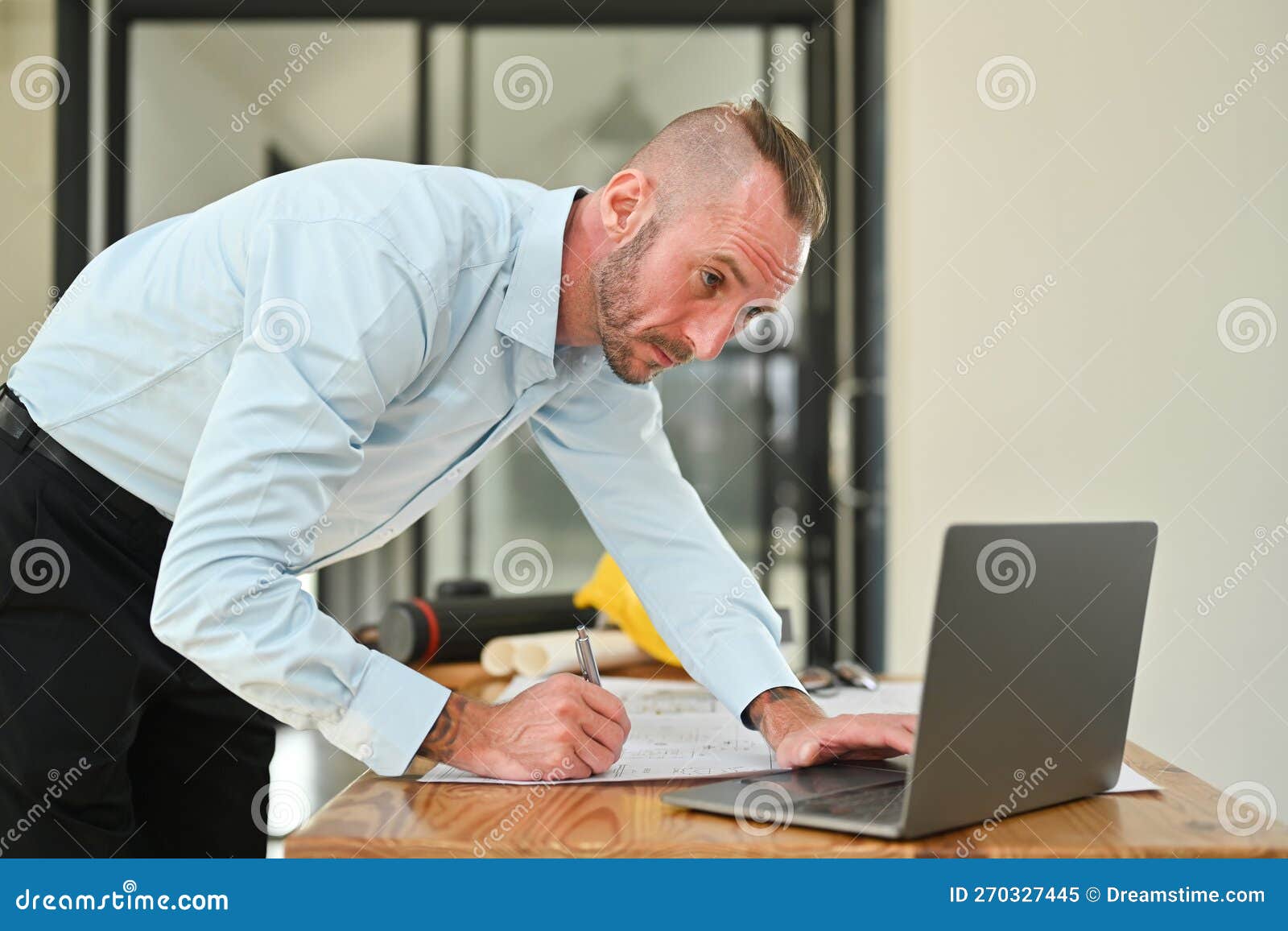 Busy Caucasian Engineers Looking at Laptop Screen and Working with ...