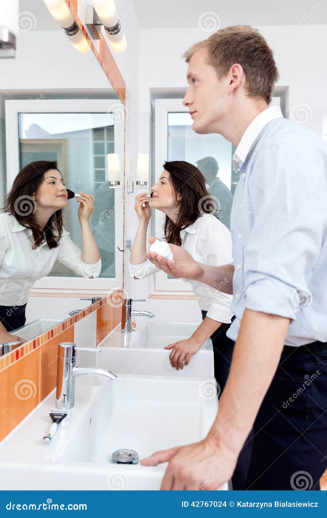 Busy couple in a bathroom stock photo. Image of happiness - 42767024