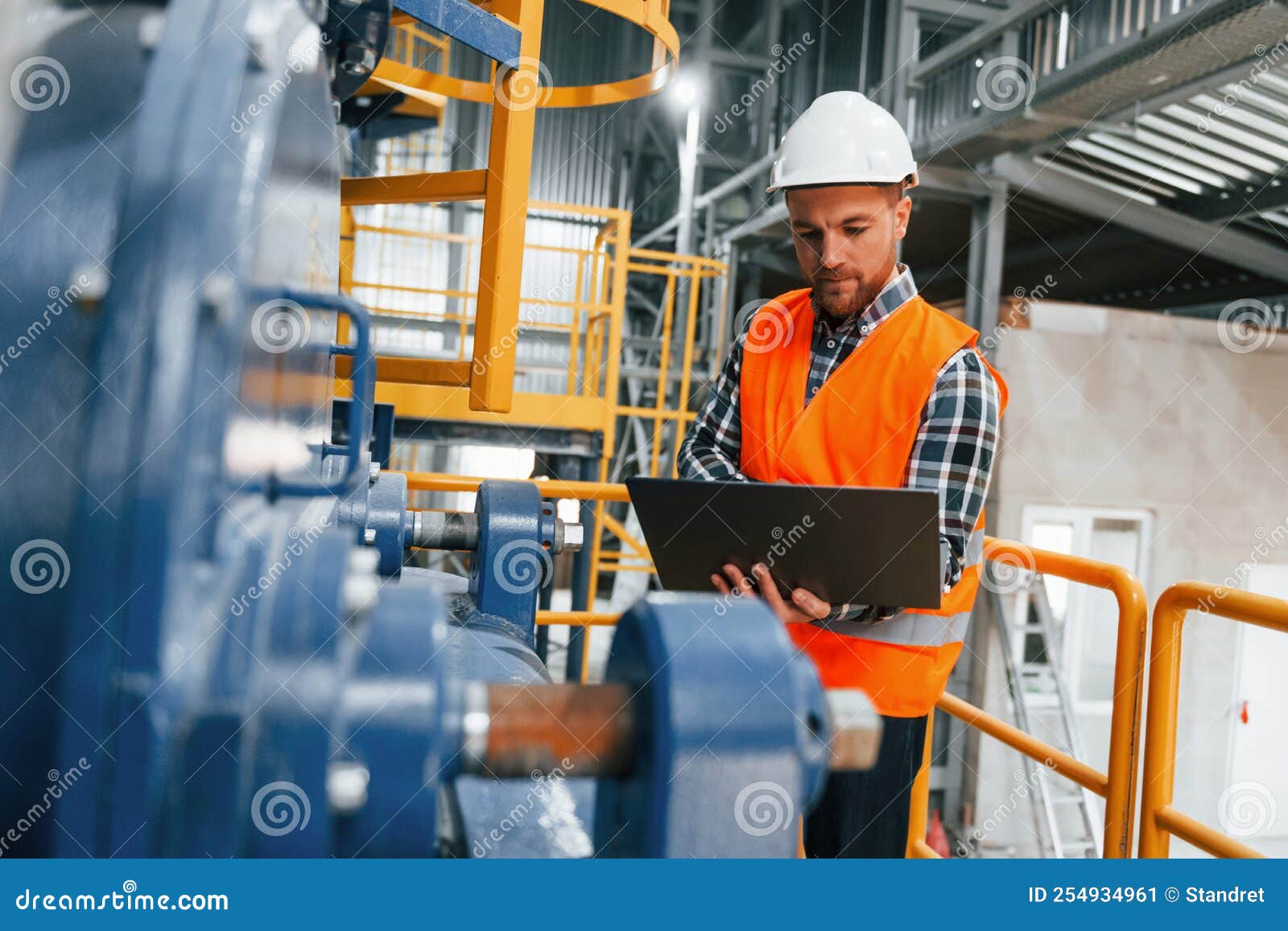 Busy Day. Construction Worker in Uniform is in the Factory Stock Image ...
