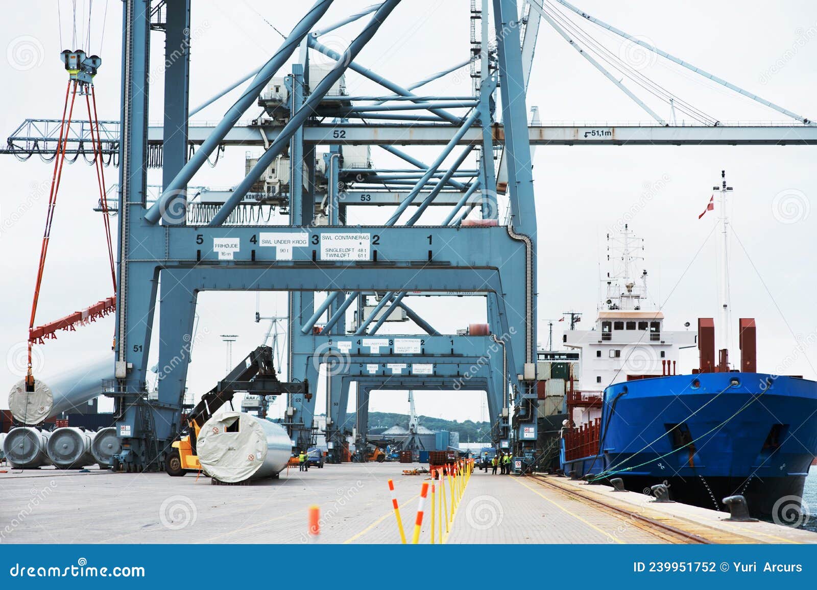 A Busy Day in the Harbour. a Massive Cargo Ship Moored at the Harbor ...