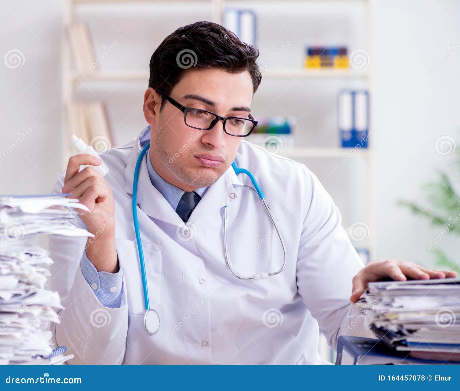 Busy Doctor with Too Much Work in Hospital Stock Photo - Image of ...