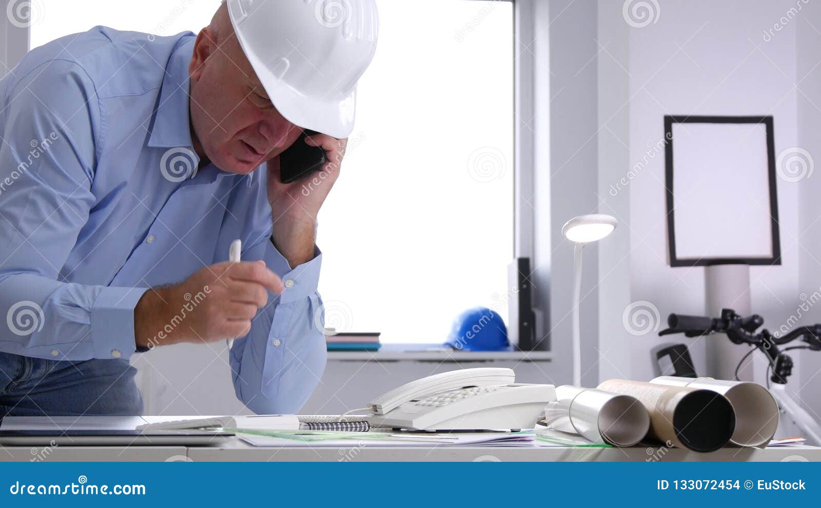 Busy Engineer Talk To Cellphone and Make Calculation Using Adding ...