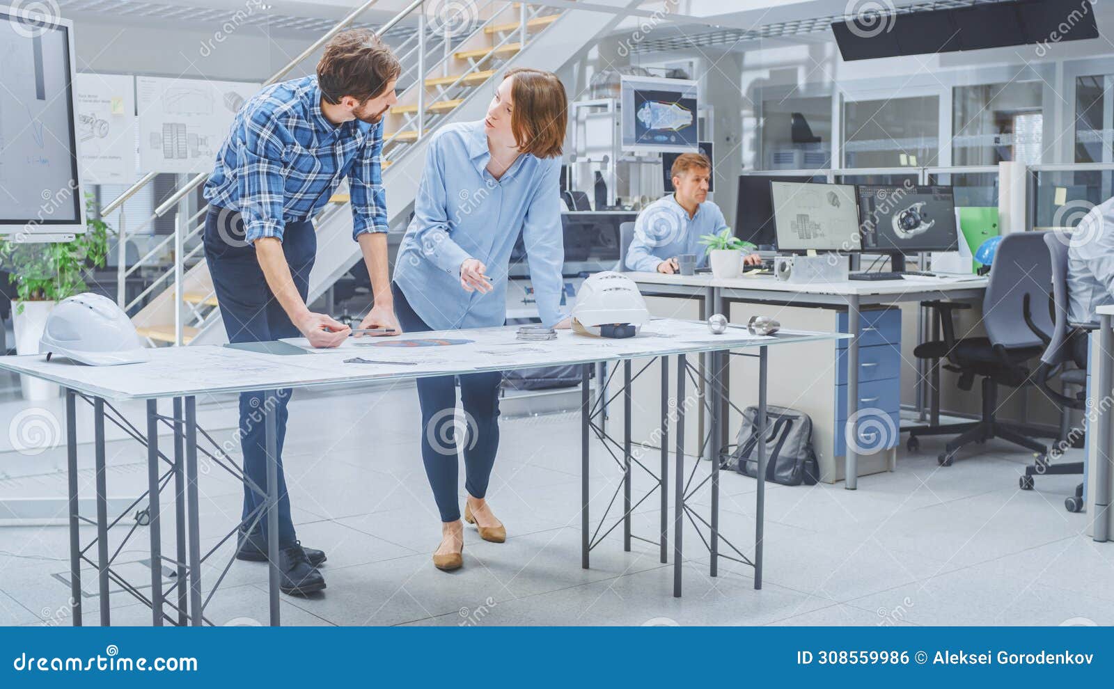 In the Busy Engineering Facility: Diverse Group of Engineers ...