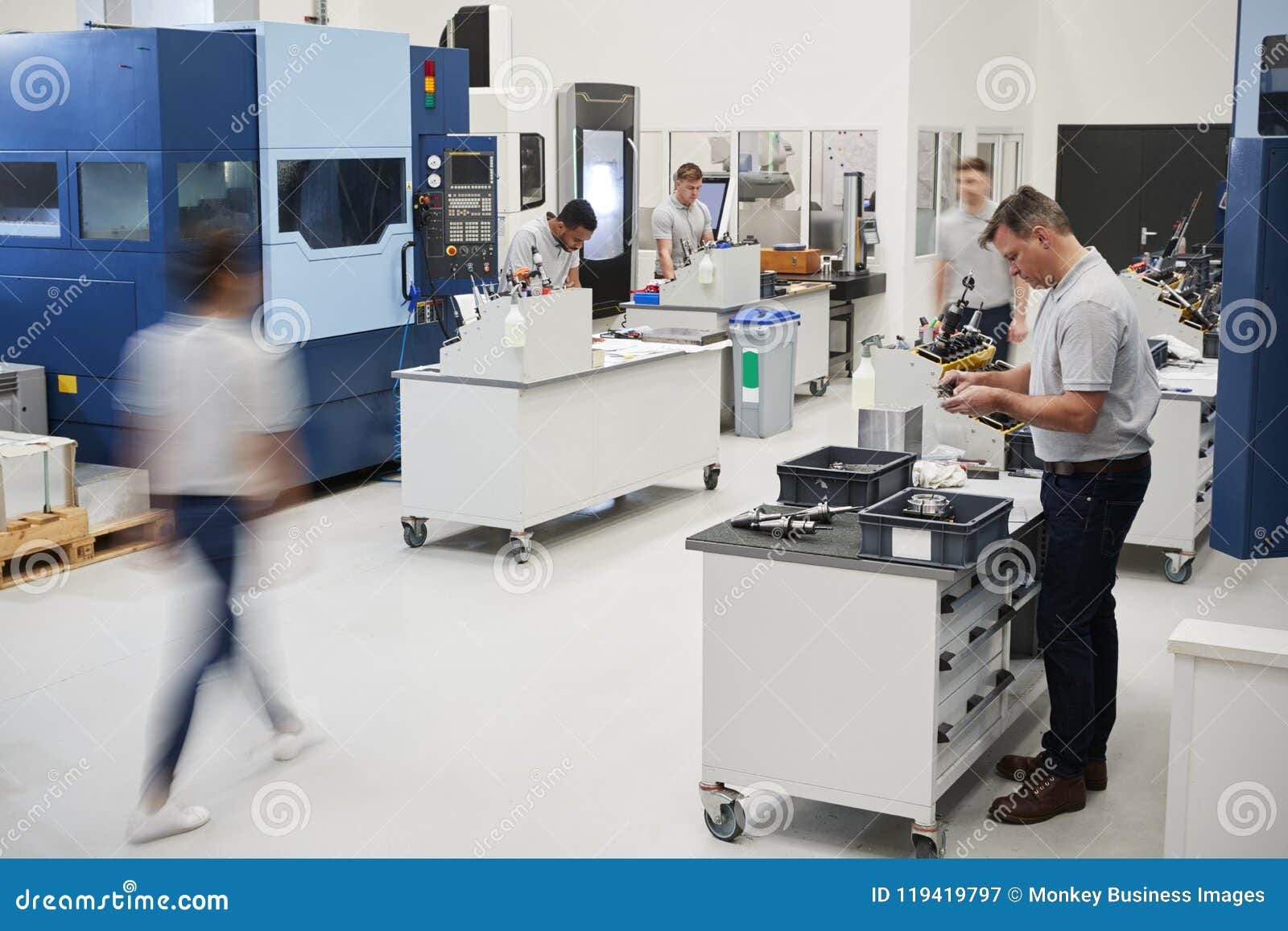 Busy Engineering Workshop with Workers Using CNC Machinery Stock Image ...