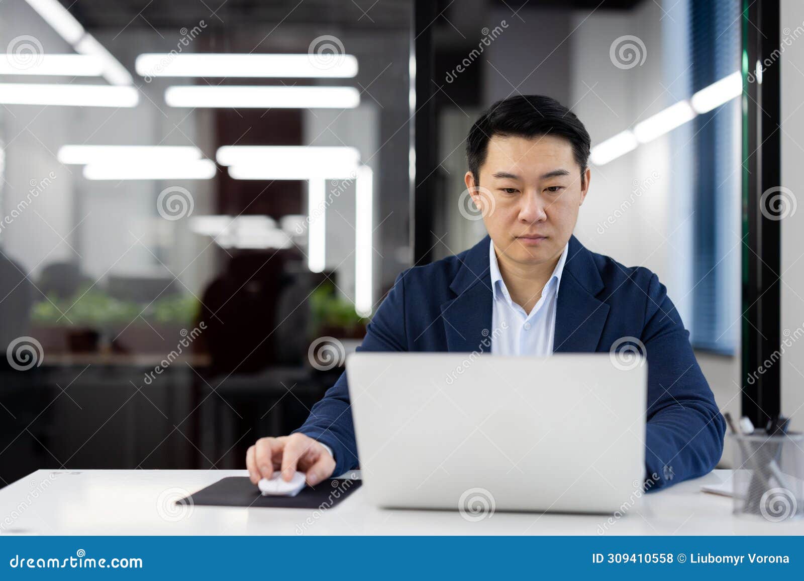 Busy Formal Office Worker Sitting by Desktop with Modern Laptop and ...