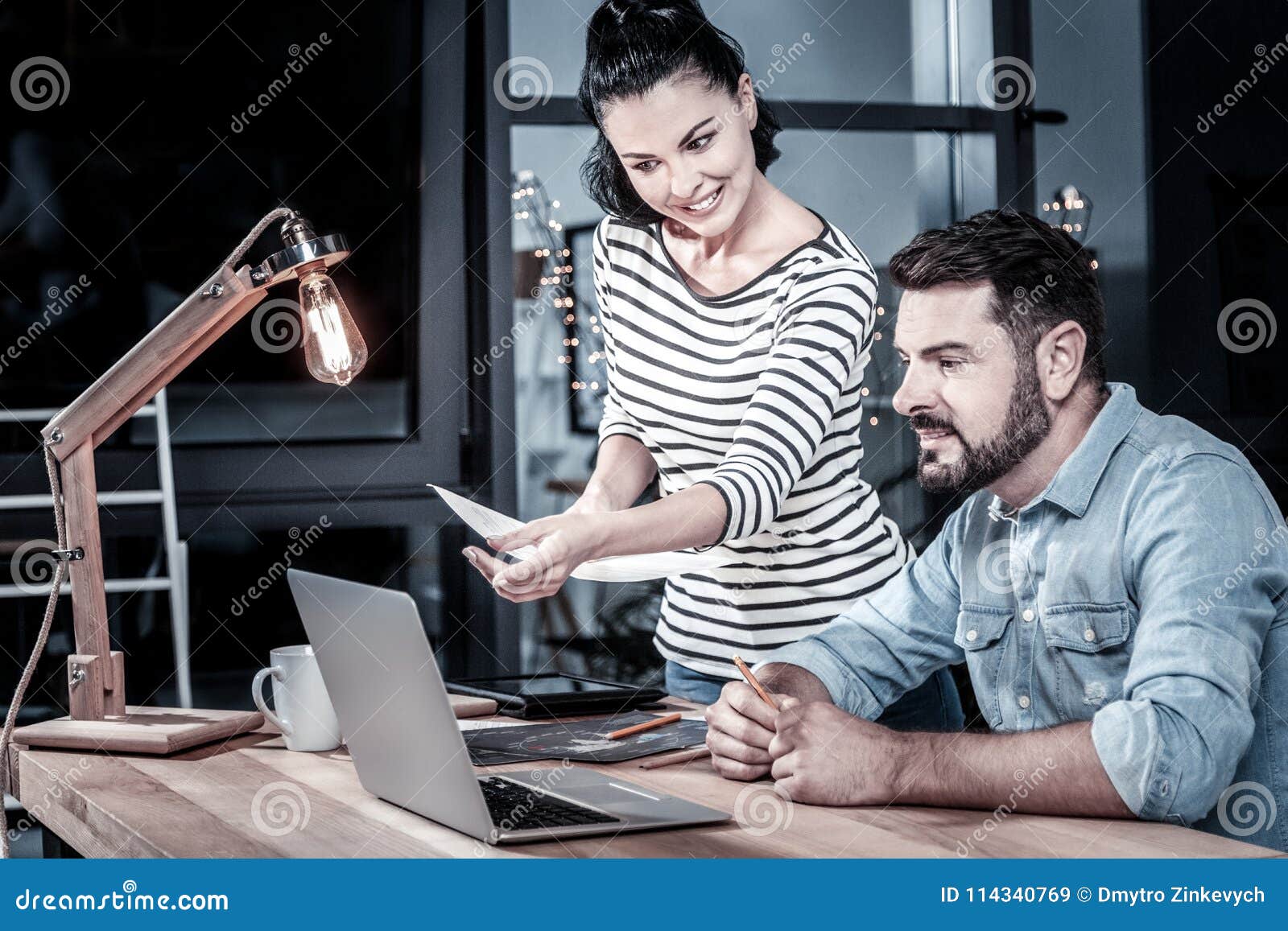Busy Friendly Partners Communicating and Using the Laptop. Stock Image ...