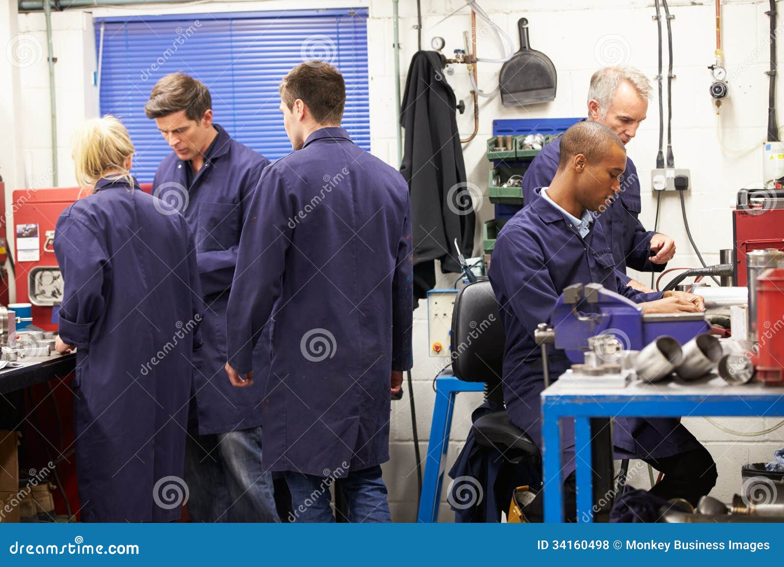 Busy Interior of Engineering Workshop Stock Photo - Image of girl ...