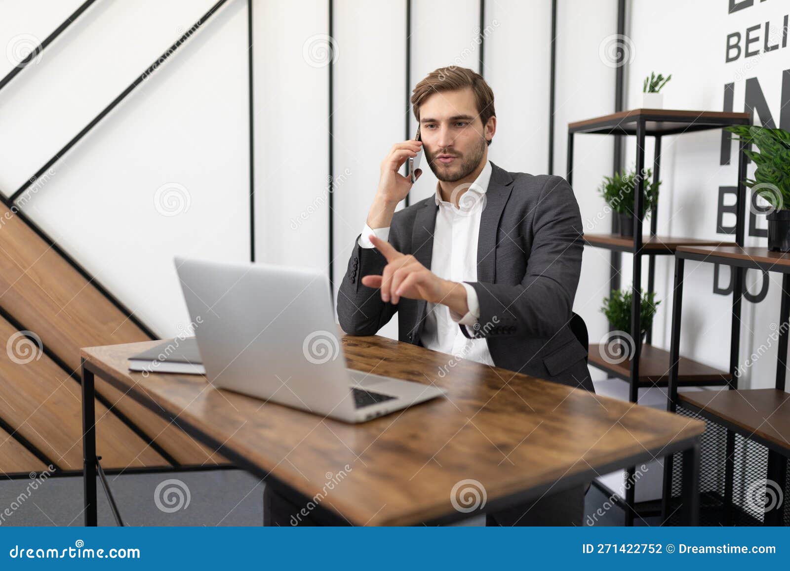 Busy Lawyer Talking on the Phone in the Office with a Client and ...