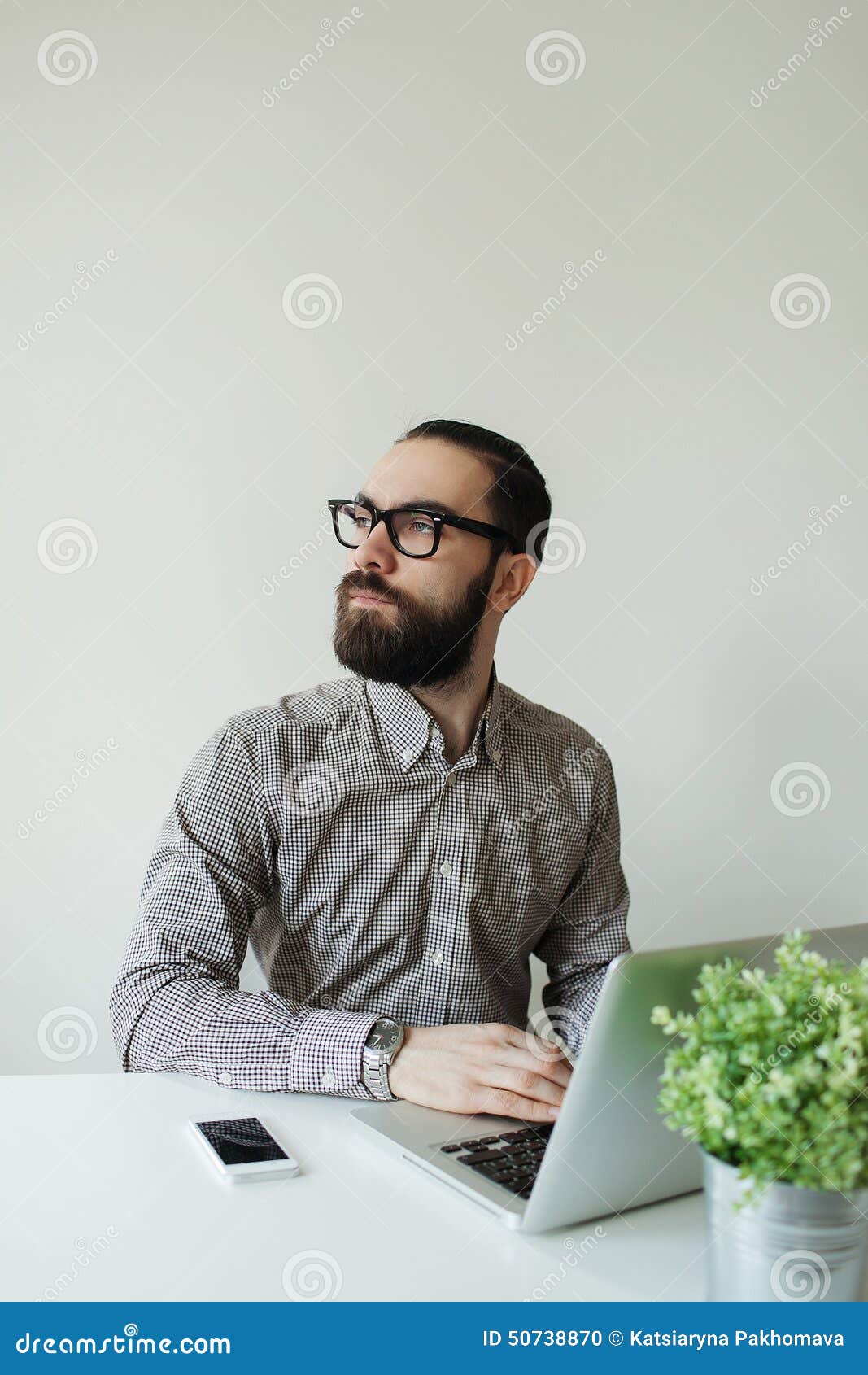 Busy Man with Beard in Glasses Thinking Over Laptop and Smartphone ...