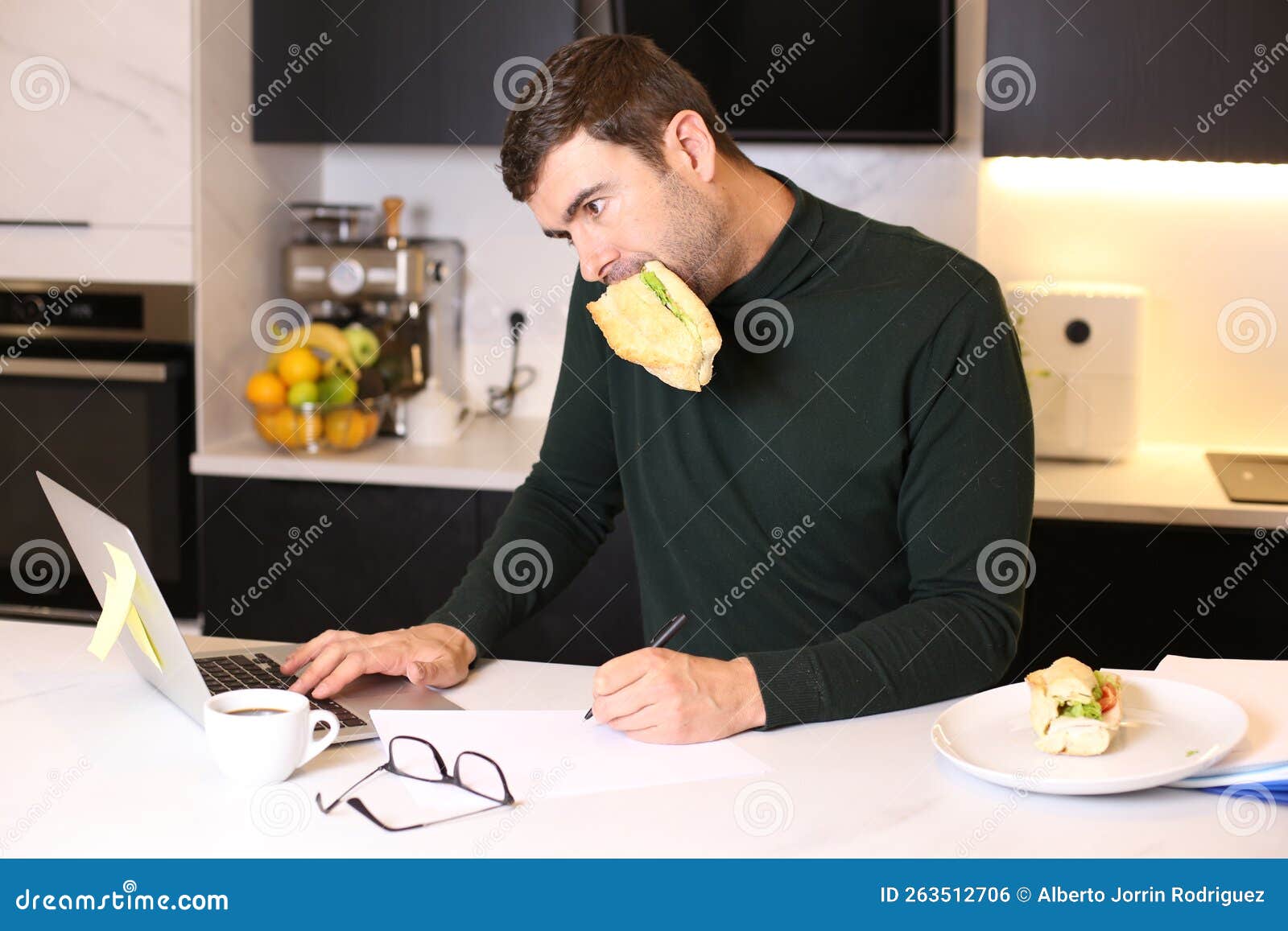 Busy Man Eating a Sandwich while on Conference Call Stock Photo - Image ...