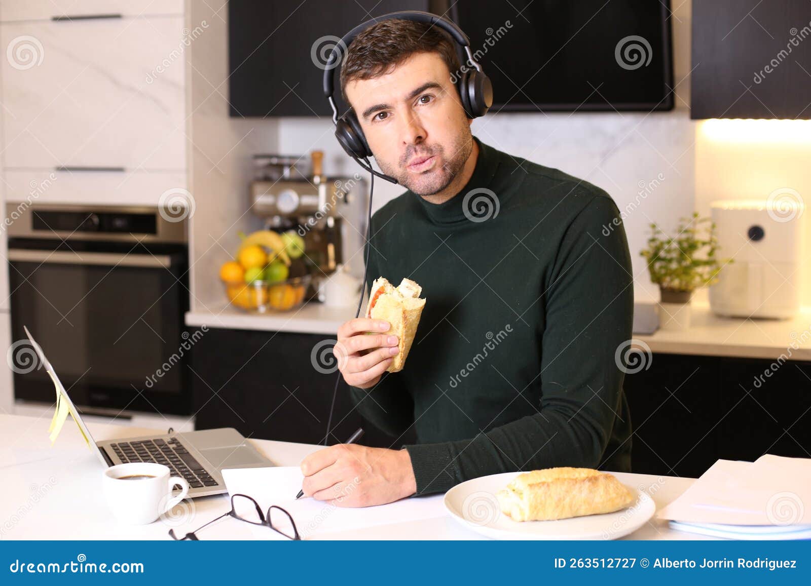 Busy Man Eating a Sandwich while on Conference Call Stock Image - Image ...