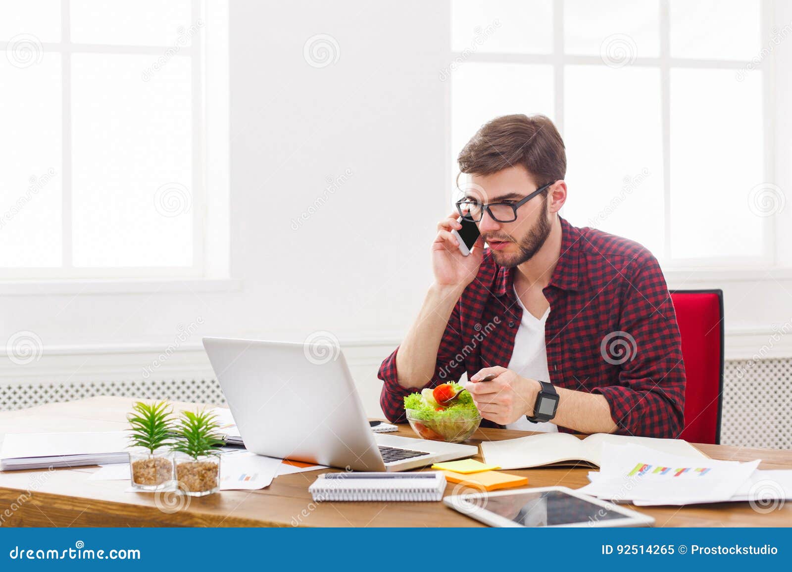 Busy Man Has Business Lunch in Modern Office Interior Stock Image ...