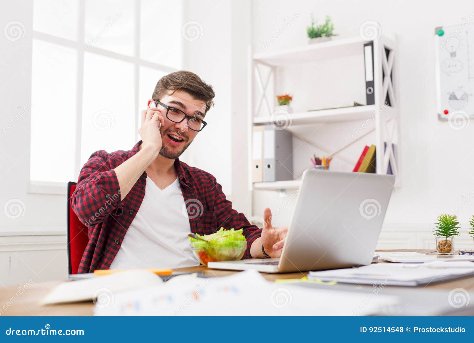 Busy Man Has Business Lunch in Modern Office Interior Stock Photo ...