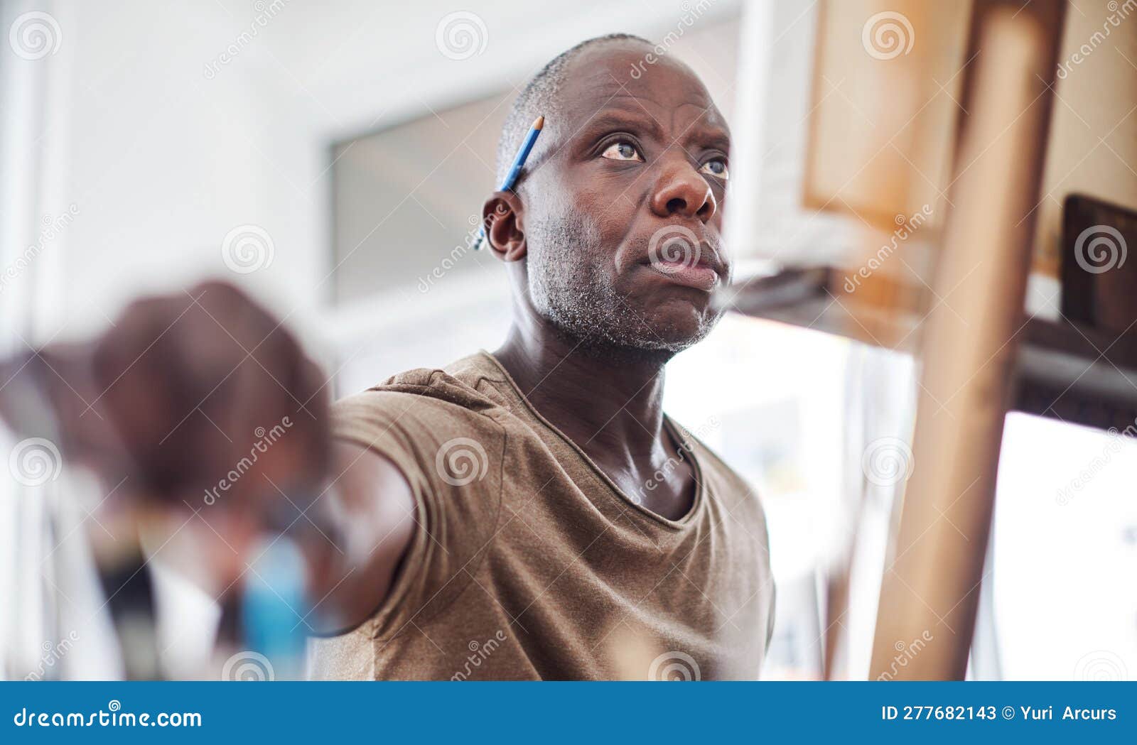 Busy the Mind with Something Creative. a Man Painting in a Art Studio ...