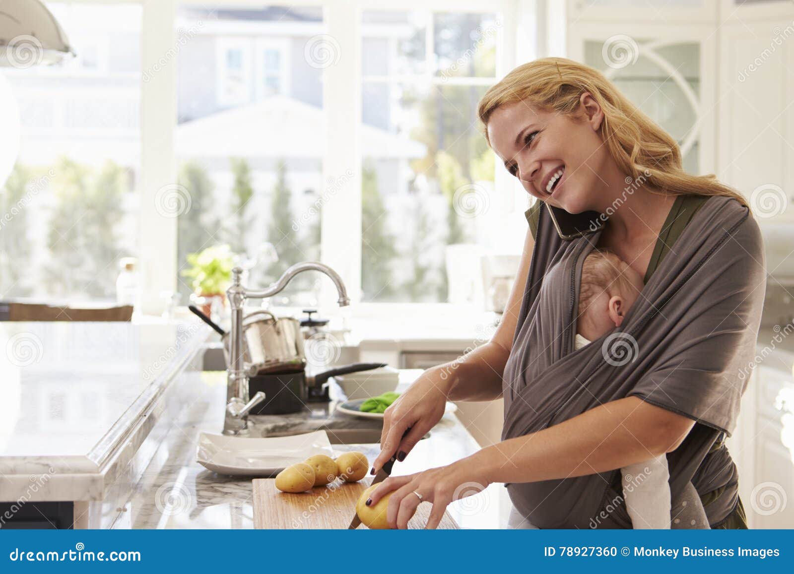 Busy Mother with Baby in Sling Multitasking at Home Stock Photo - Image ...