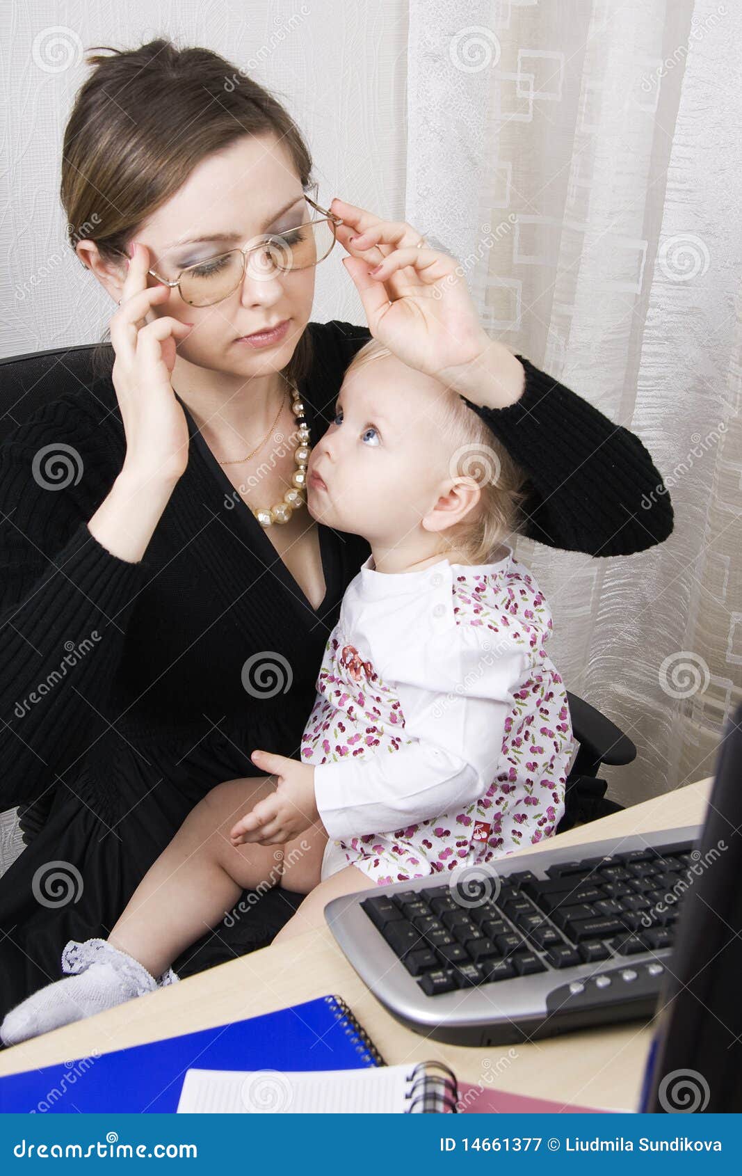 Busy mother with her baby stock image. Image of family - 14661377