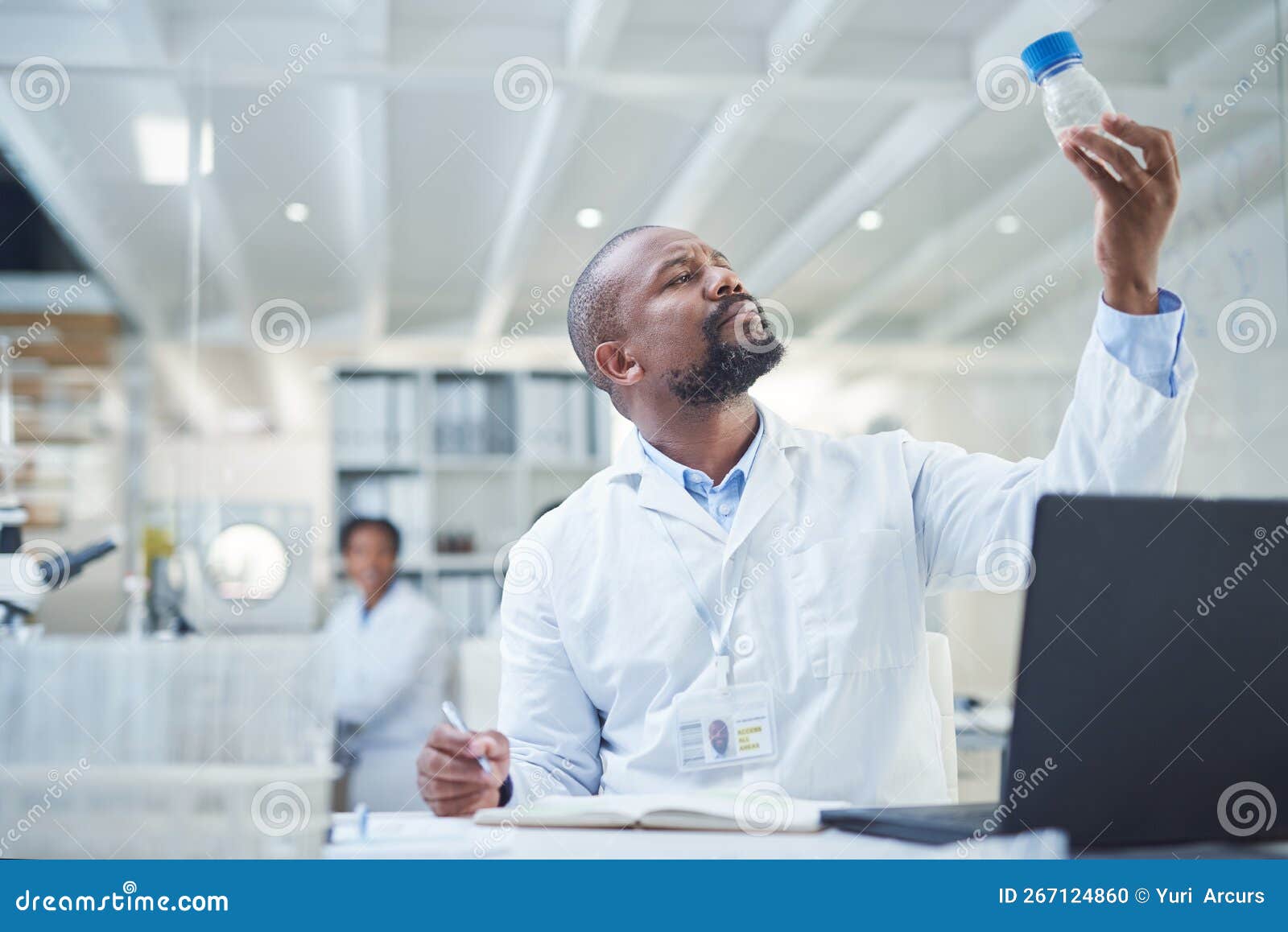 Busy with a New Clinical Trial. a Mature Scientist Working in a Lab ...