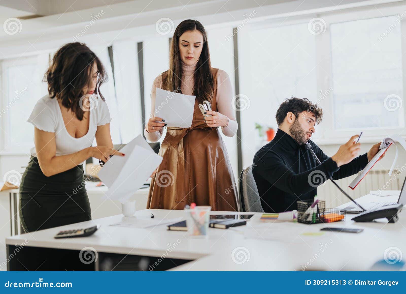 Busy Office Atmosphere with Focused Coworkers Engaging in Teamwork and ...