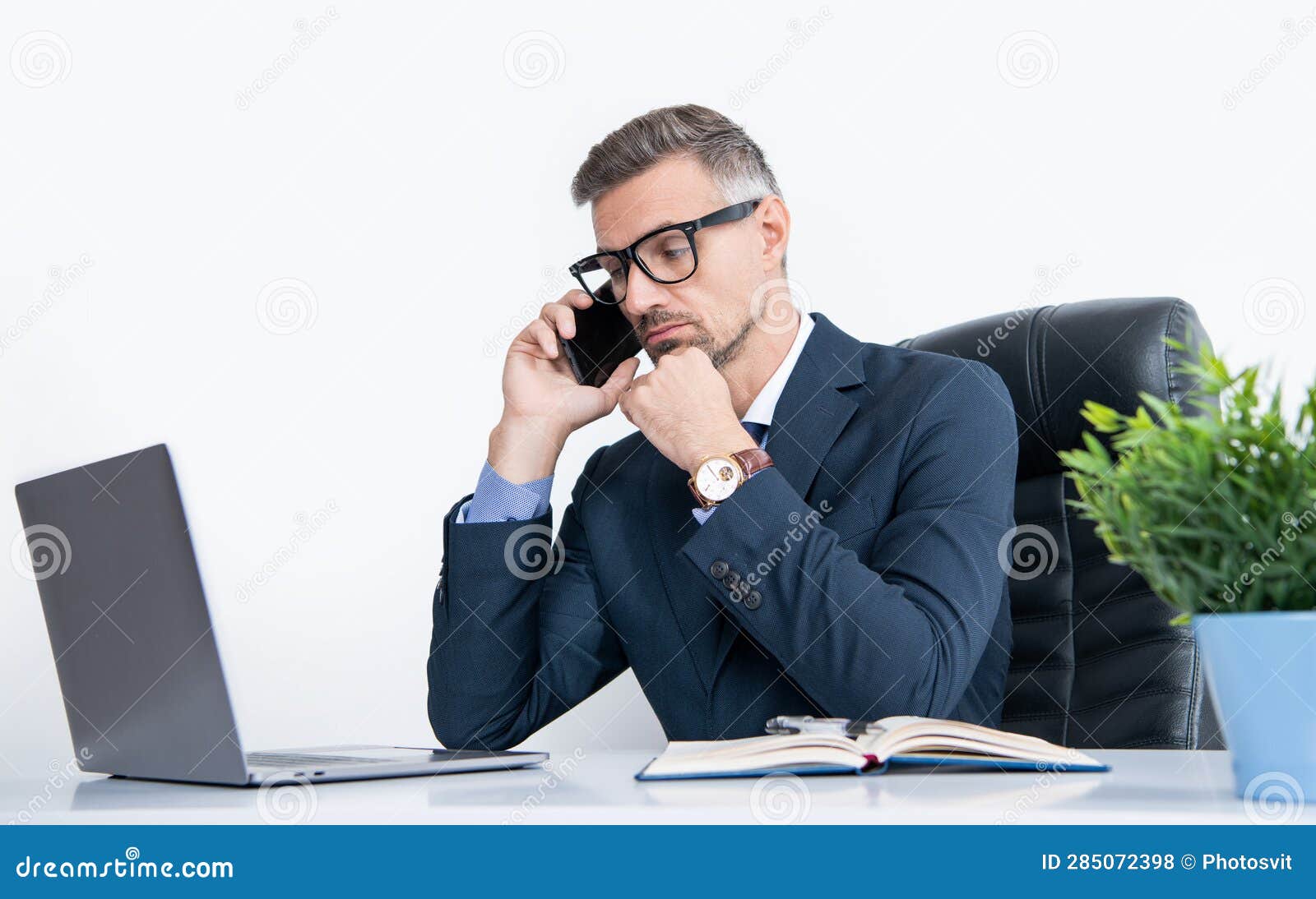 Busy Office Worker in Eyewear Talking on Phone with Computer Stock ...