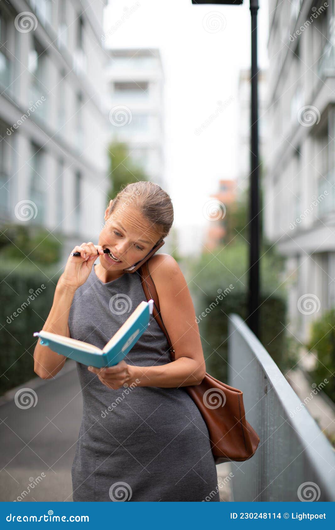 Busy Personal Assistant Calling on the Phone and Taking Notes Stock ...