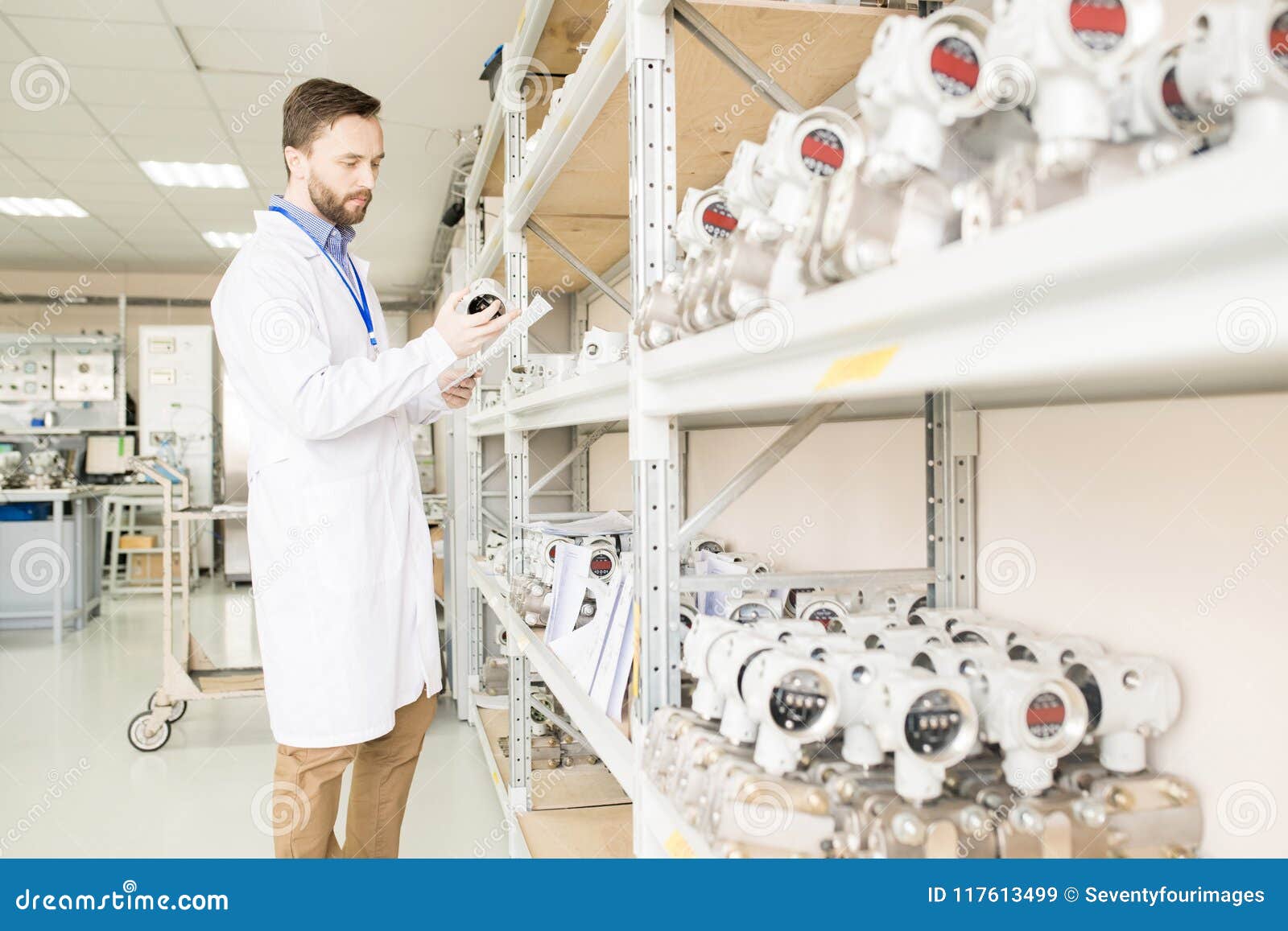 Busy Quality Control Engineer Examining Manometers in Warehouse Stock ...