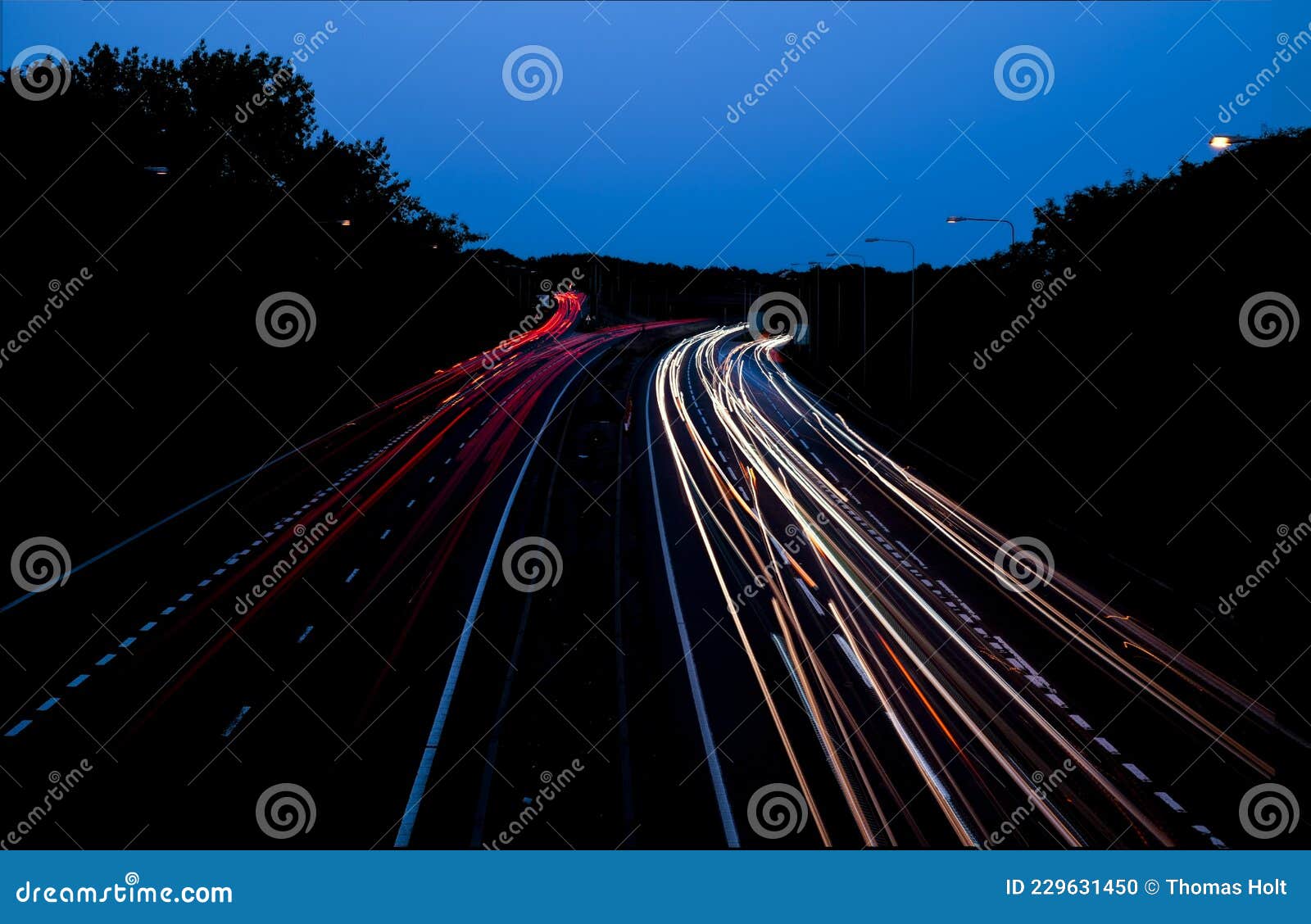 Busy Road at Night with Light Trails Left by Moving Cars Stock Photo ...