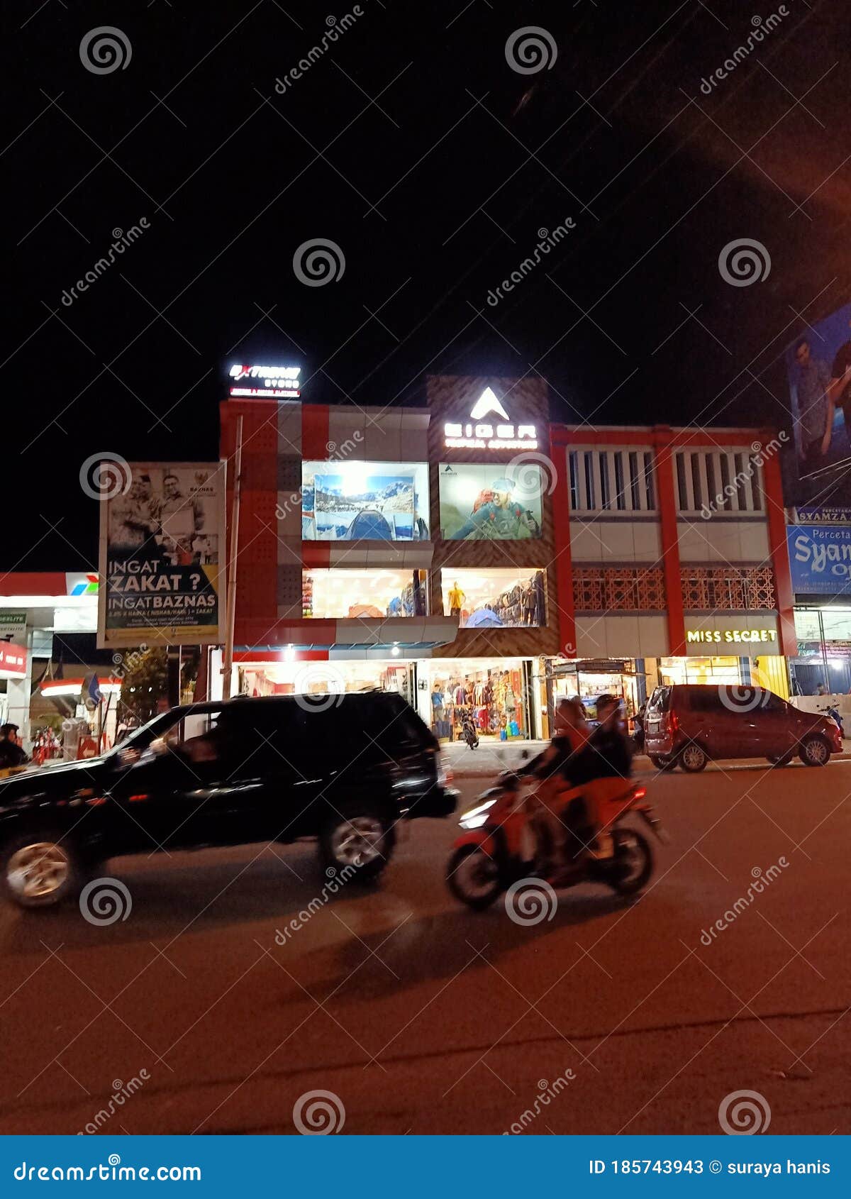 Busy road night town editorial stock photo. Image of restaurant - 185743943