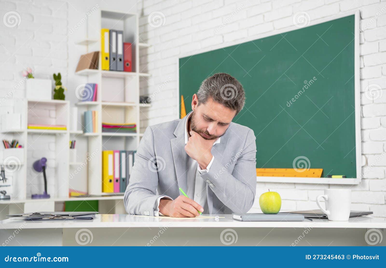 Busy School Teacher in Classroom at Blackboard Stock Image - Image of ...